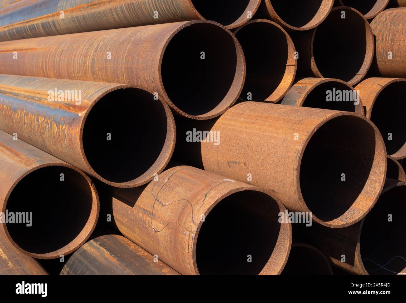 rusty steel pipes stacked on a construction site Stock Photo - Alamy
