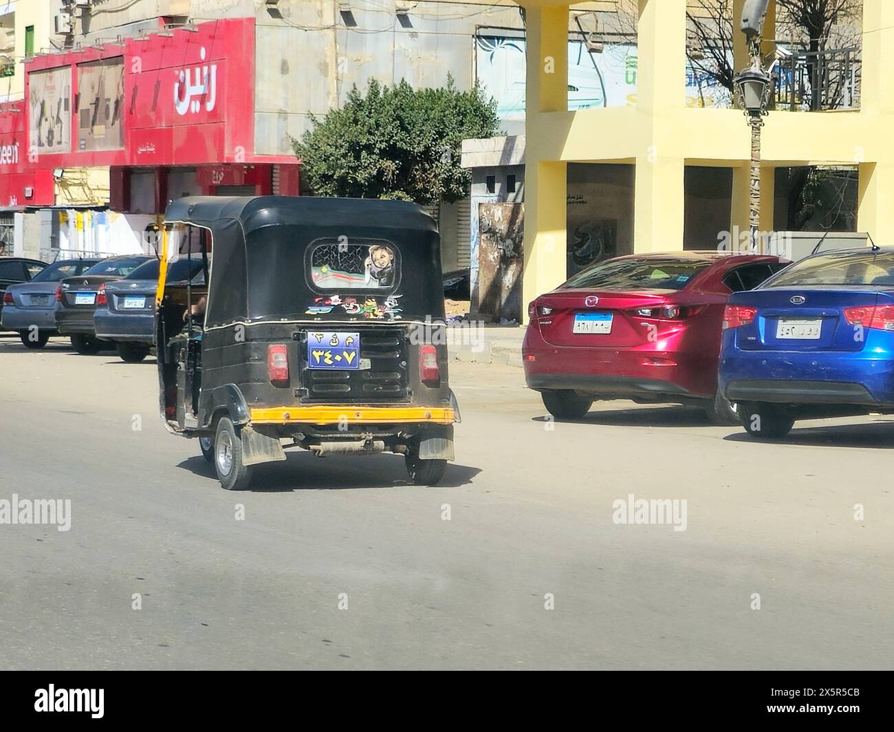 Cairo, Egypt, April 4 2024: auto rickshaw, baby taxi, mototaxi, pigeon ...