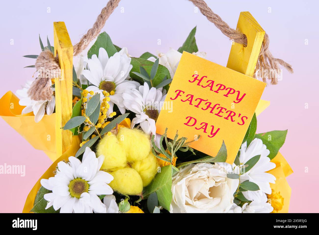 HAPPY FATHER'S DAY text on a yellow sticker in a bouquet of flowers ...