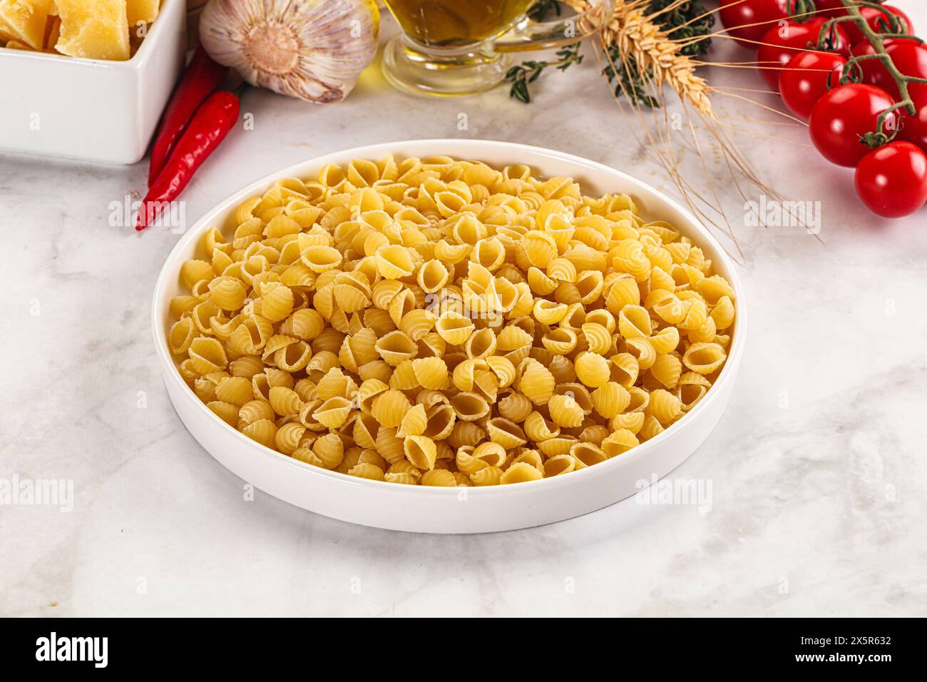 Italian cuisine - dry conchiglie shell pasta Stock Photo - Alamy