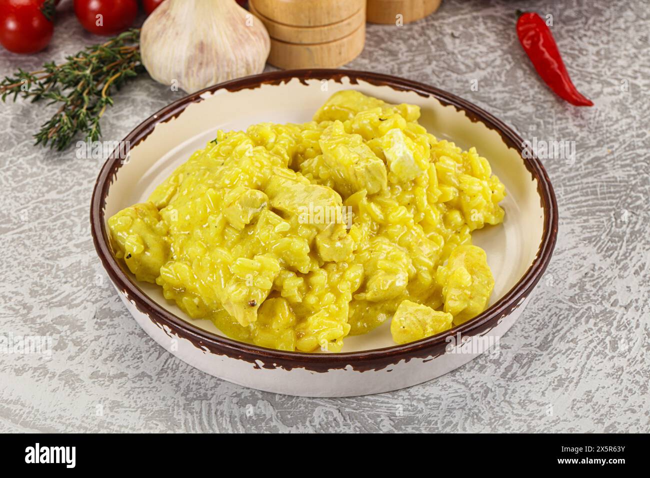 Italian cuisine - yellow risotto with chicken and soft cheese Stock ...