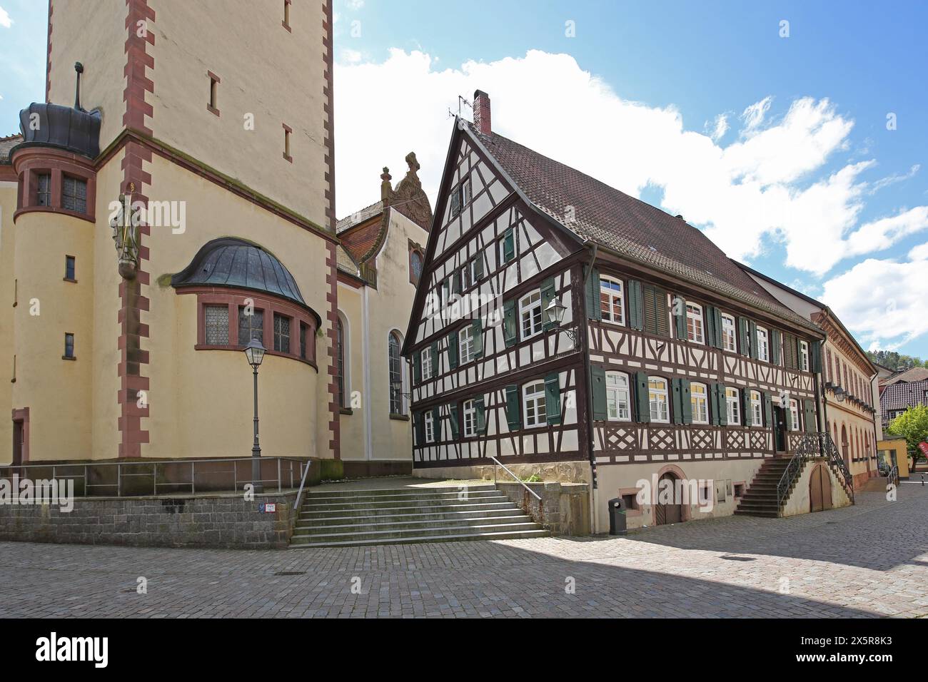 Half-timbered house with St Arbogast church, Haslach, Kinzigtal ...