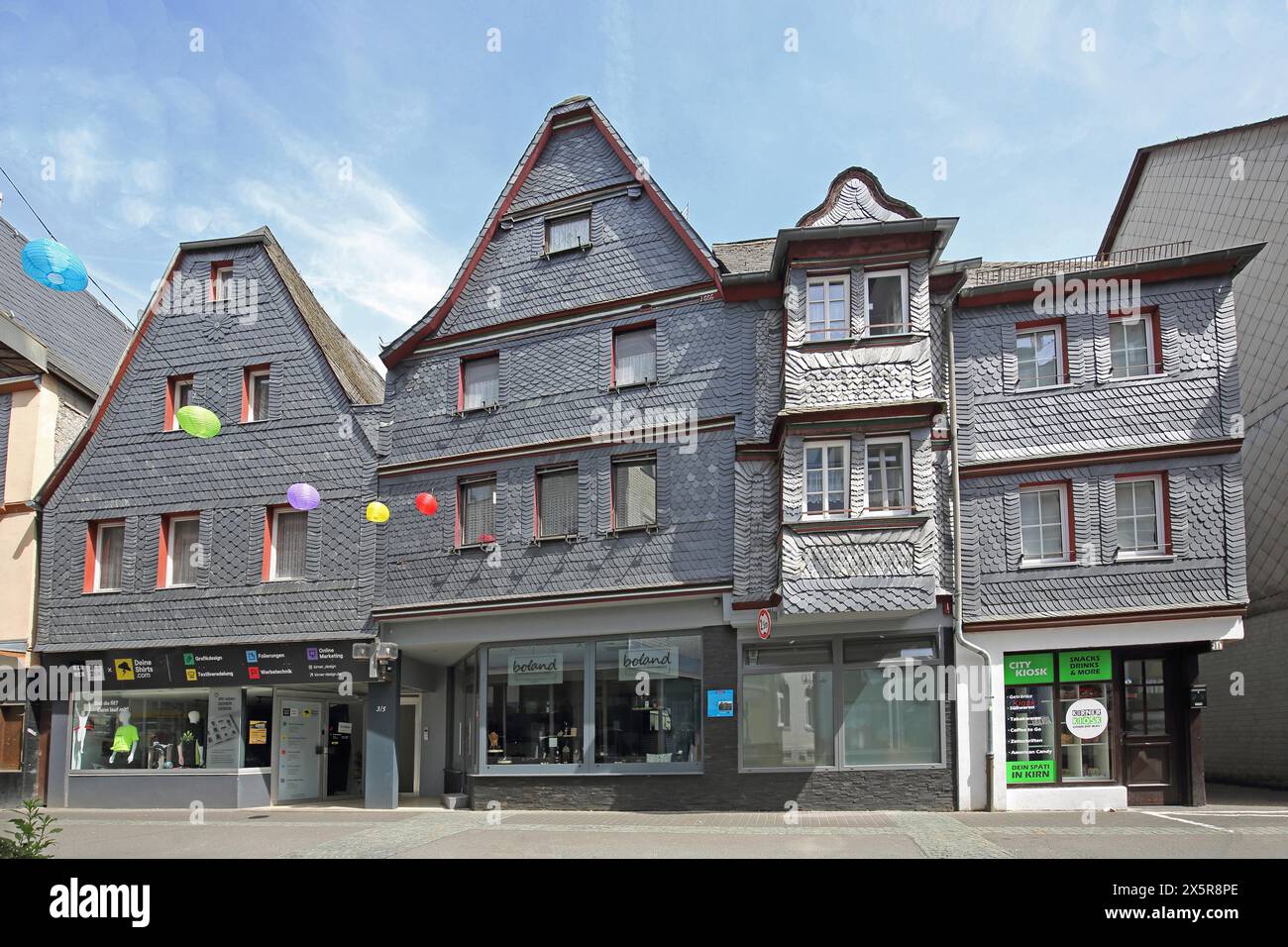 Four grey historic slate houses built in the 17th century with slate ...