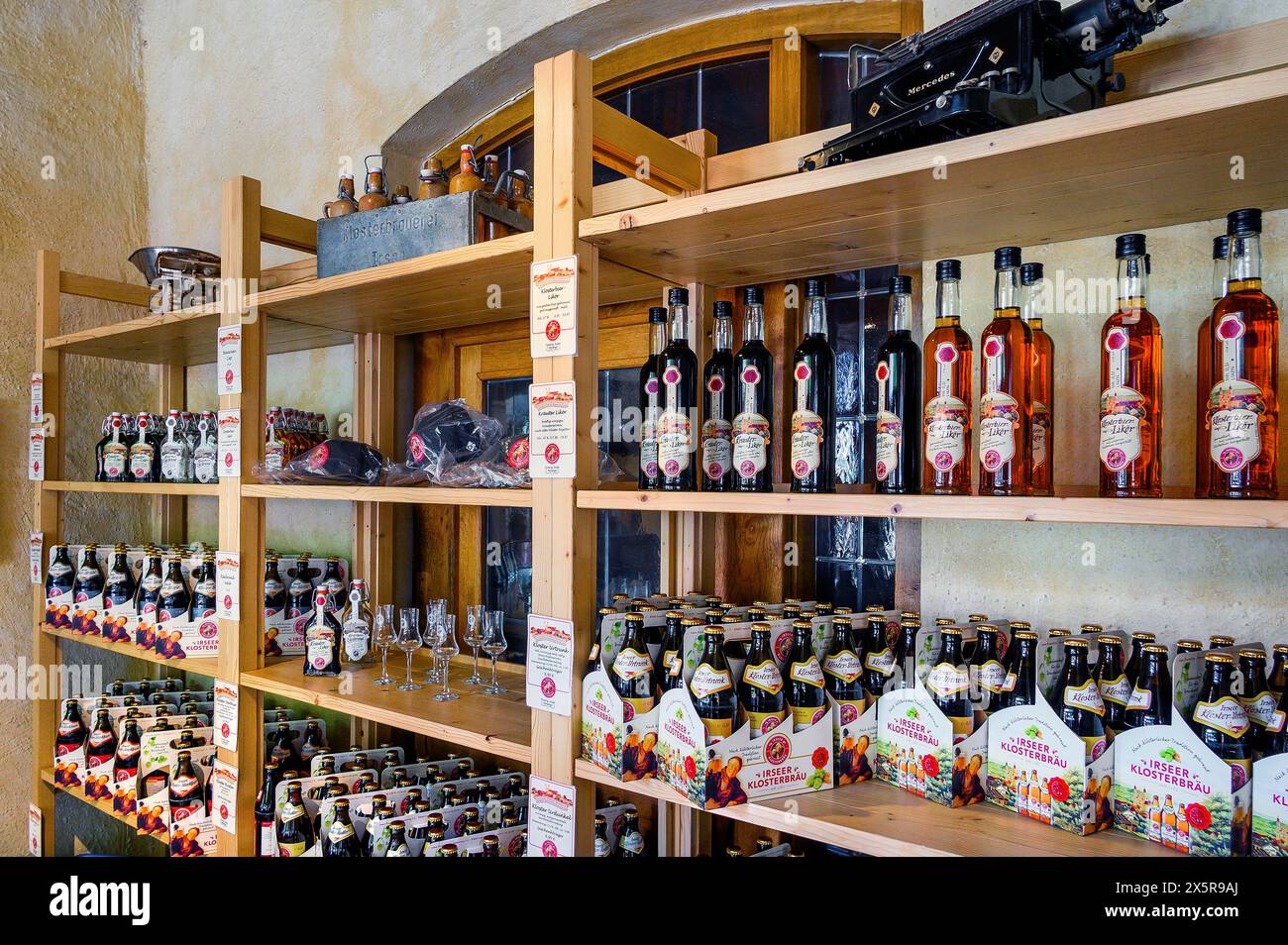 Bottles of beer and monastery liqueur in the Braeushop, Brauereigasthof ...