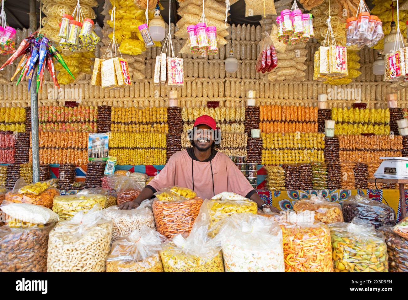 Indian man, 20 years old, selling traditional rice snacks, Arthunkal ...