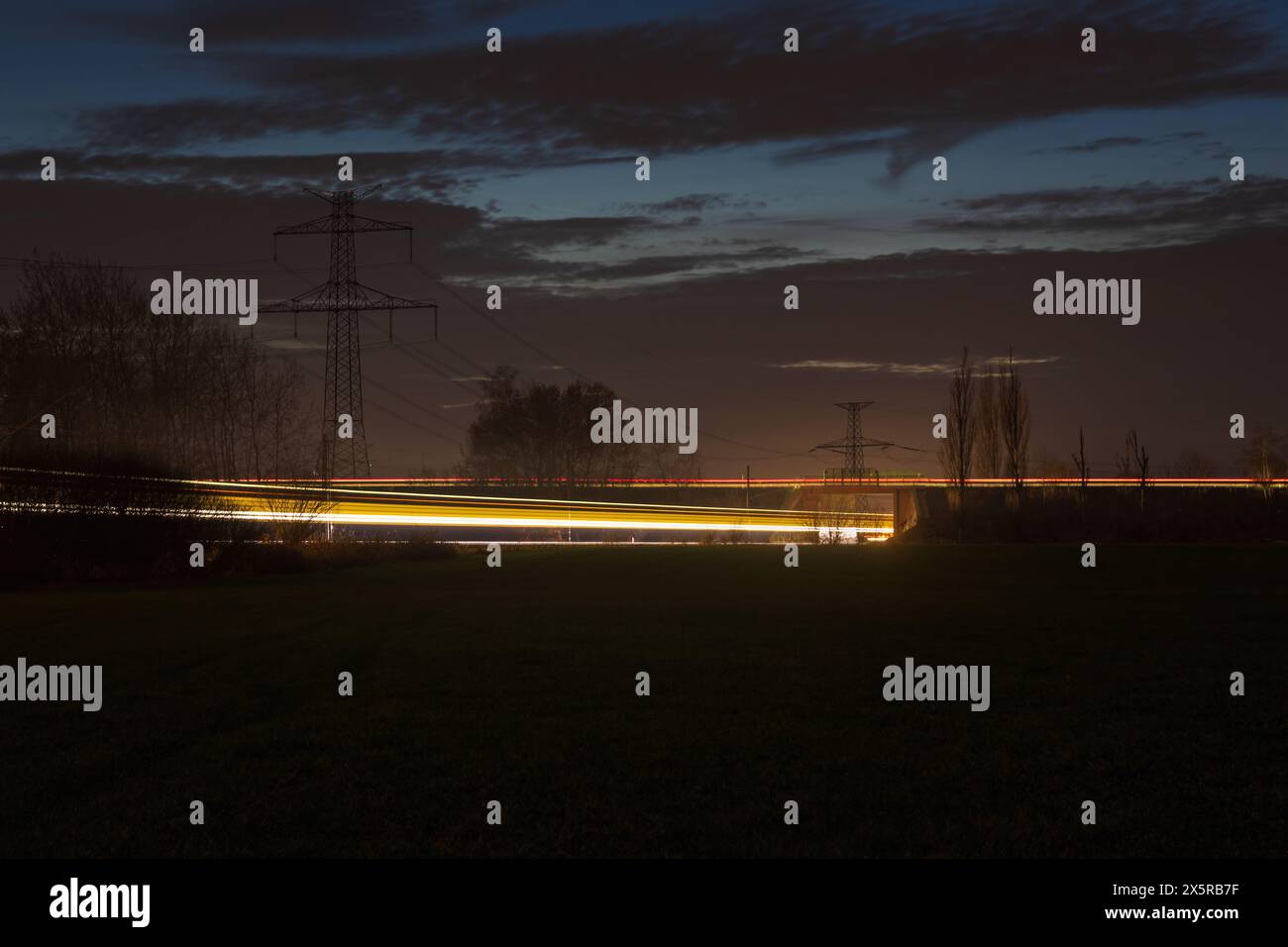 Train ride through viaduct with car on top at night landscape ...