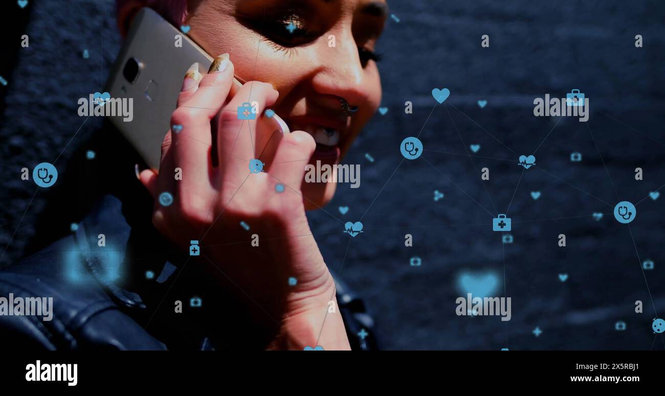 Image of connected icons over smiling biracial woman talking on smartphone Stock Photo - Alamy
