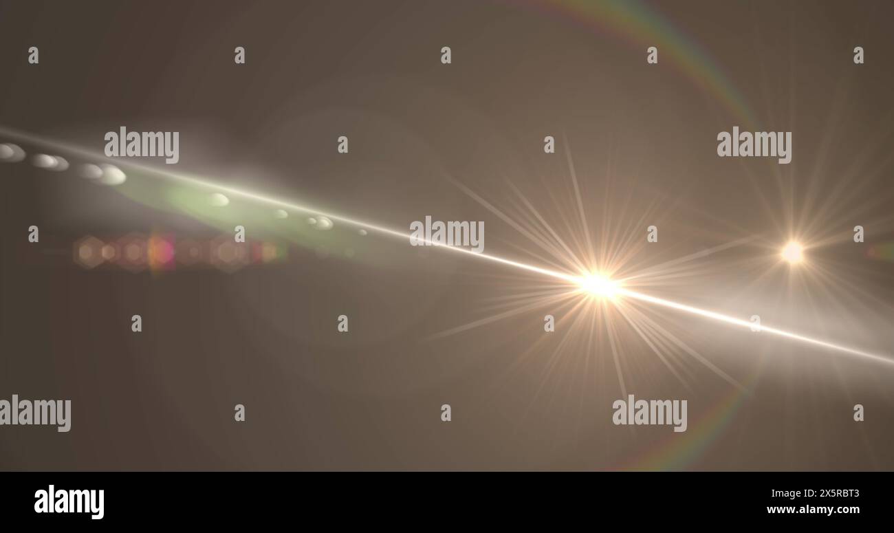 Digital image of spot of light and lens flare against copy space on ...