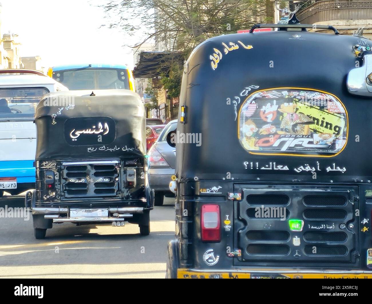Cairo, Egypt, April 19 2024: auto rickshaw, baby taxi, mototaxi, pigeon ...