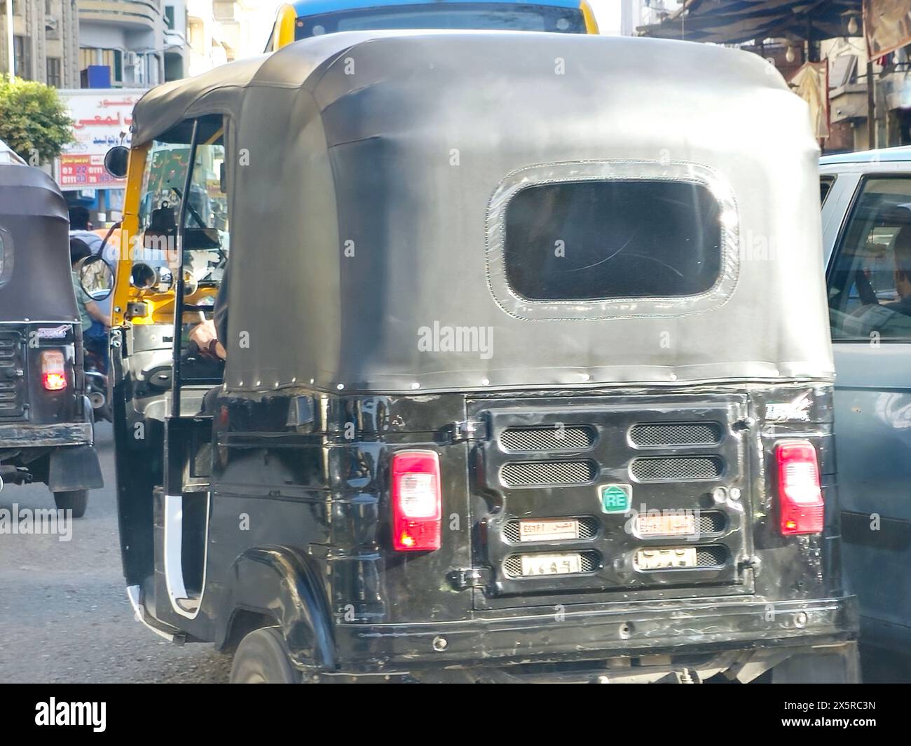 Cairo, Egypt, April 19 2024: auto rickshaw, baby taxi, mototaxi, pigeon ...
