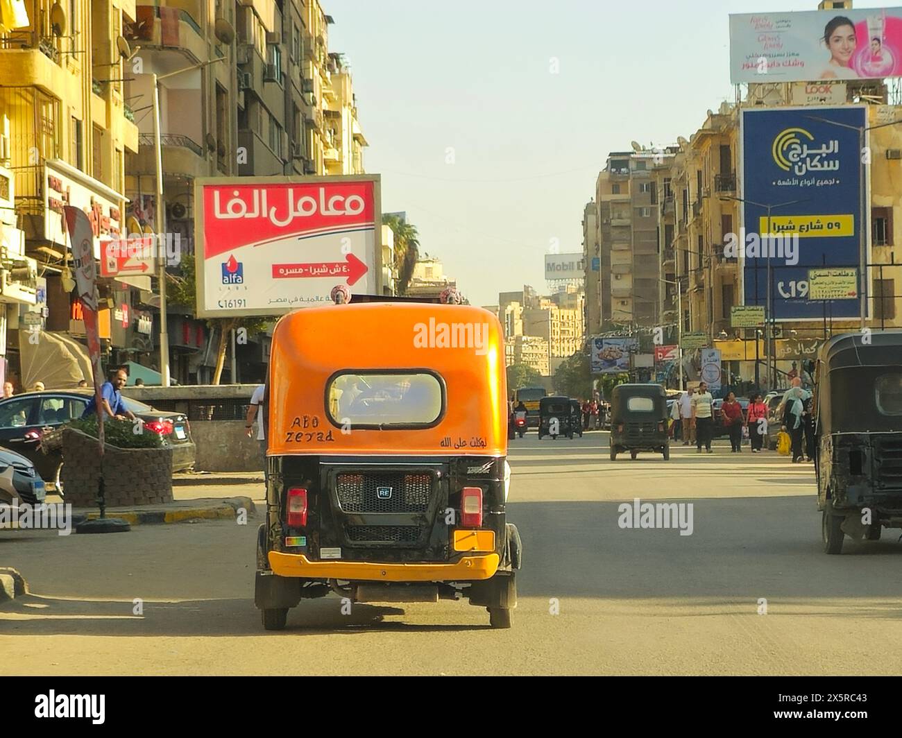 Cairo, Egypt, April 19 2024: auto rickshaw, baby taxi, mototaxi, pigeon ...