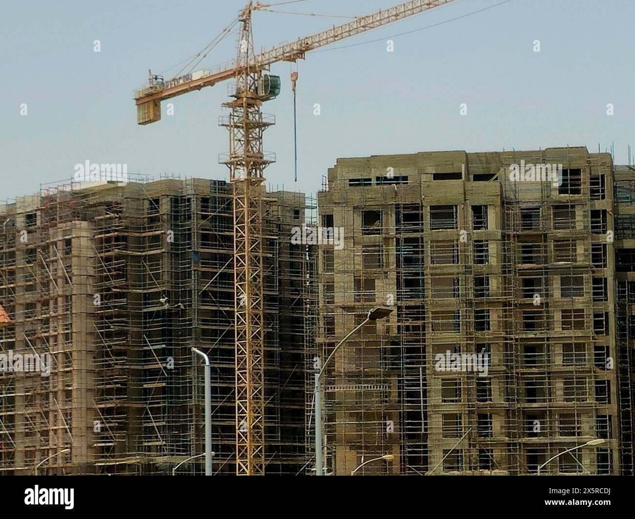 Giza, Egypt, April 25 2024: A construction site with crane towers of ...