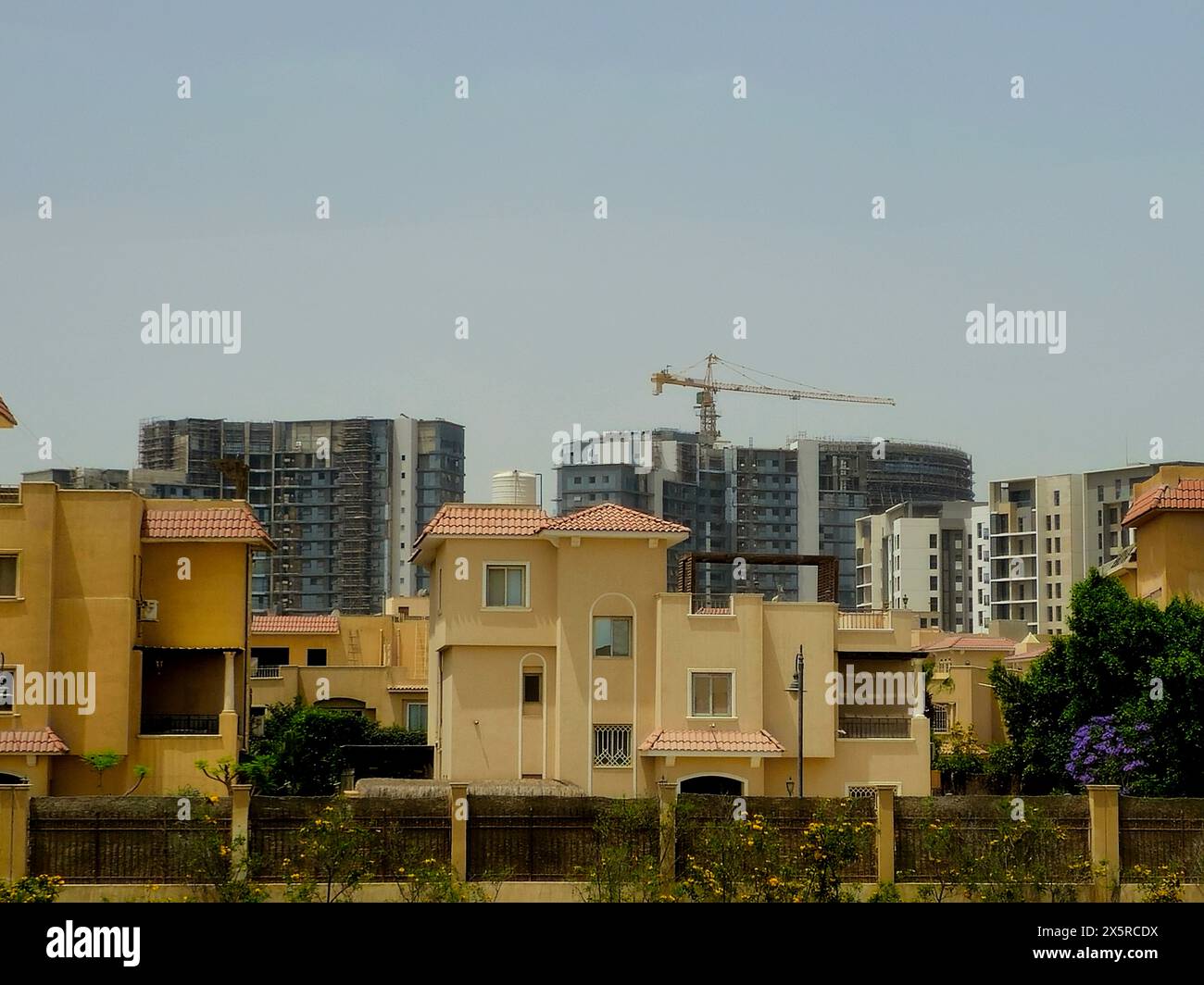 Giza, Egypt, April 25 2024: A construction site with crane towers of ...
