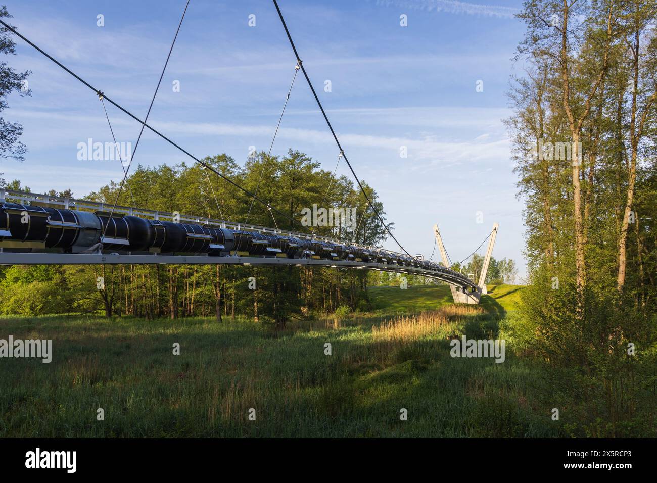 Heat line bridge from side with tree. Industry architecture in landcape ...