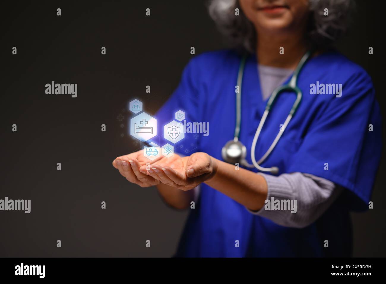 Modern medical icons over senior doctor hands. Medical innovative ...