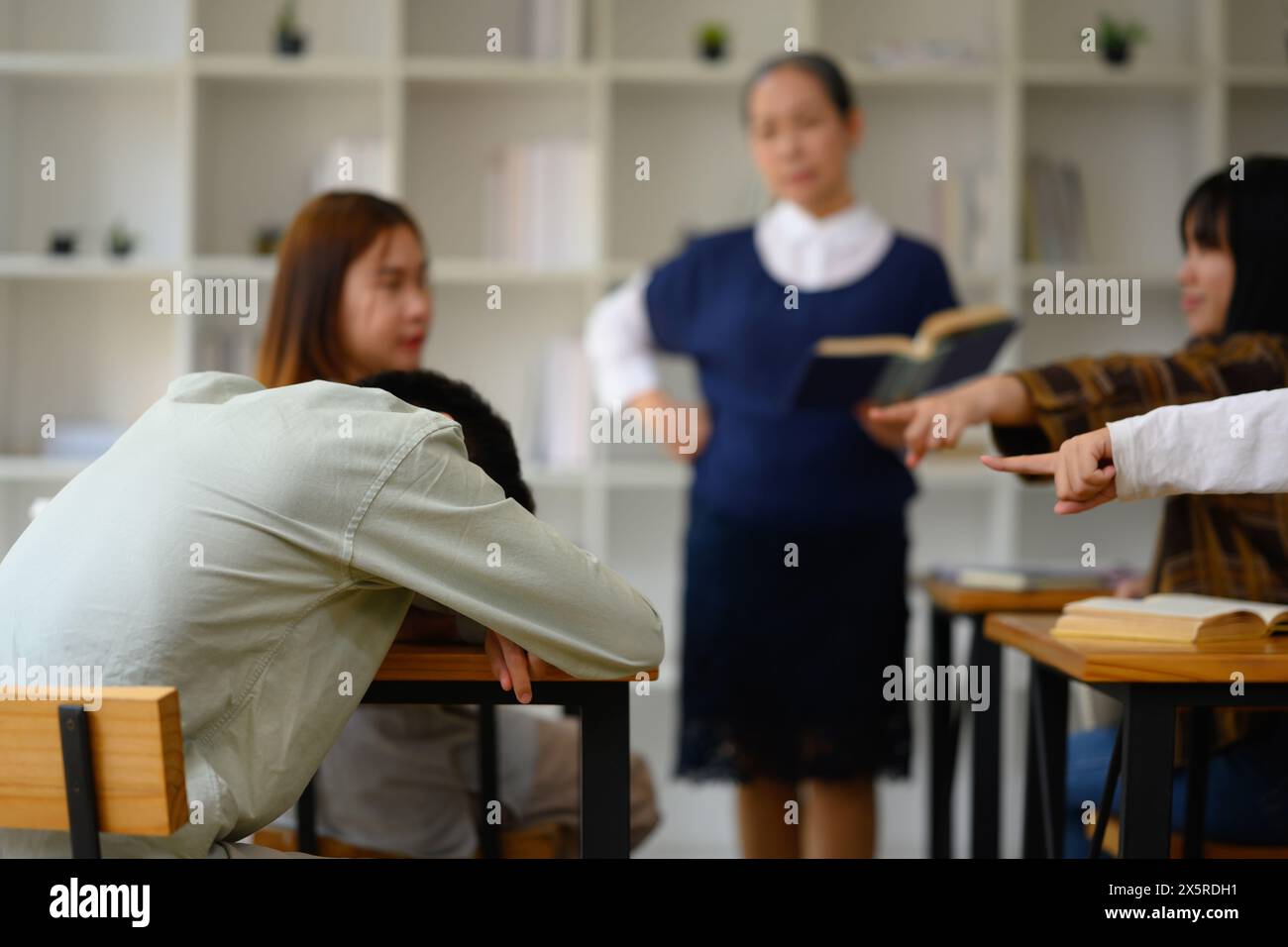 Instructor helping student during hi-res stock photography and images - Alamy