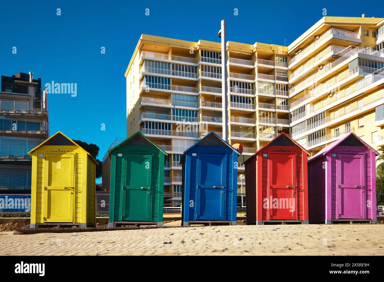 Brightly painted summer beach change rooms at the beach Stock Photo - Alamy