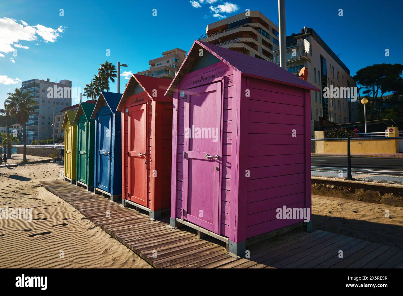 Brightly painted summer beach change rooms Stock Photo - Alamy