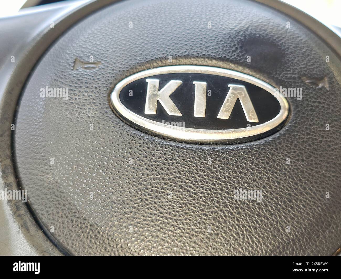 Cairo, Egypt, May 1 2024: KIA sign on a steering wheel of Cerato 2011 ...