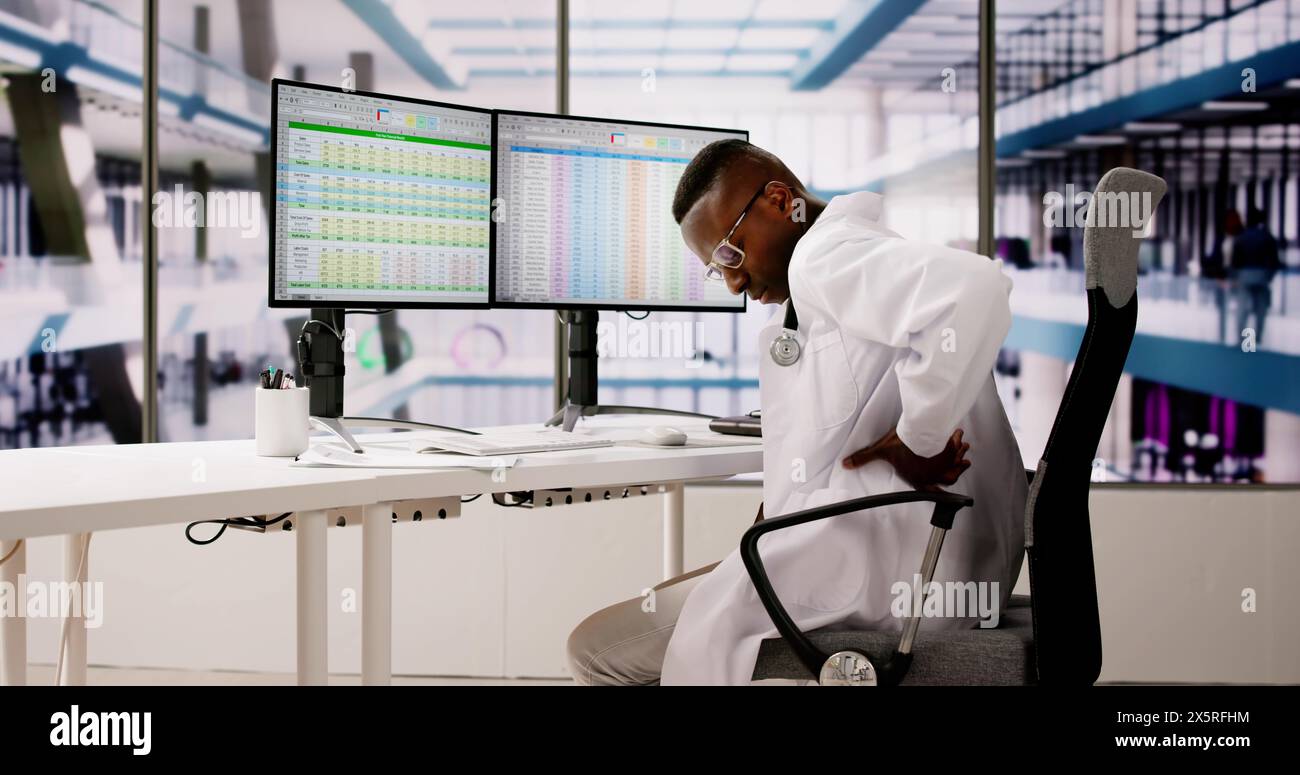 Medical Doctor With Back Pain. Bad Posture Stock Photo - Alamy