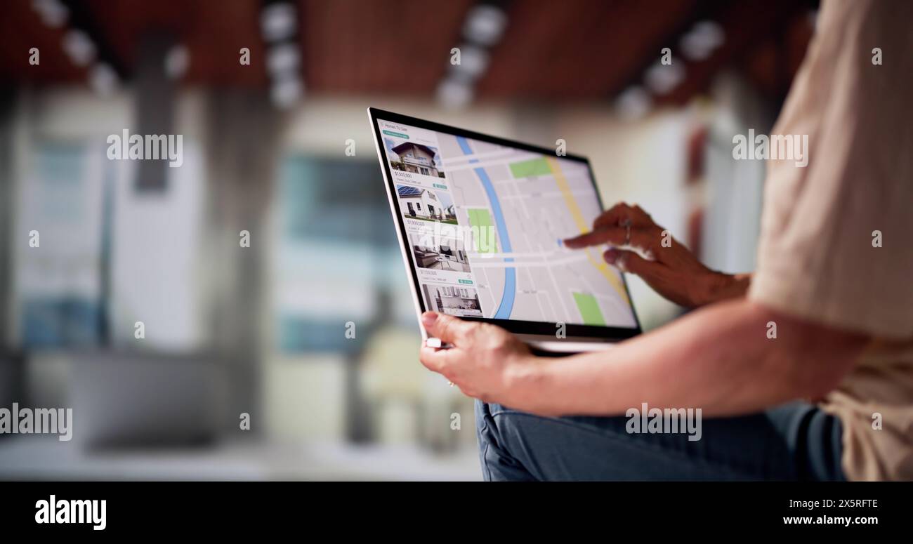 Searching Real Estate House Or Apartment Online Stock Photo - Alamy