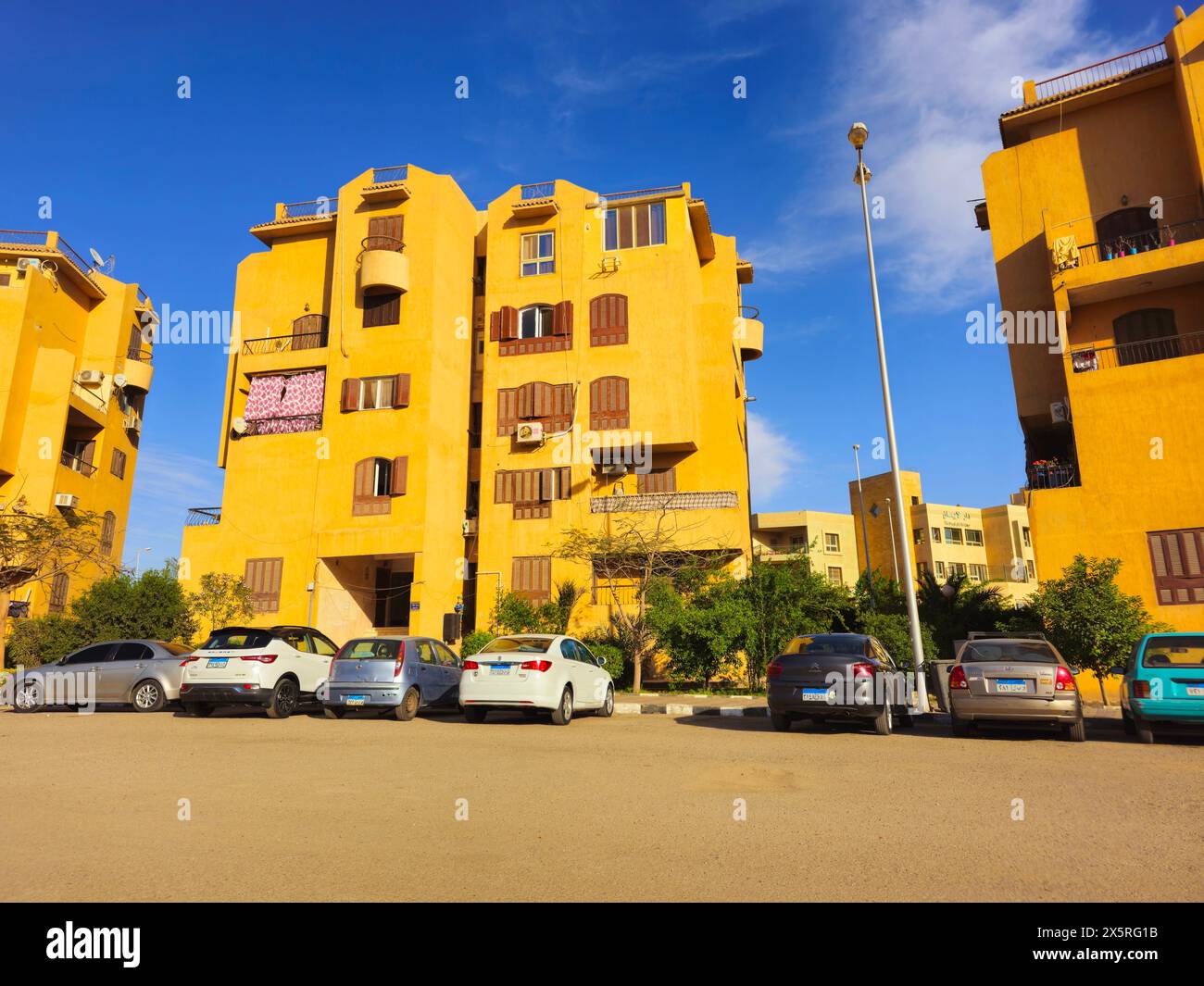 Cairo, Egypt, April 16 2024: A residential building at the daytime against a blue sky in Cairo ...