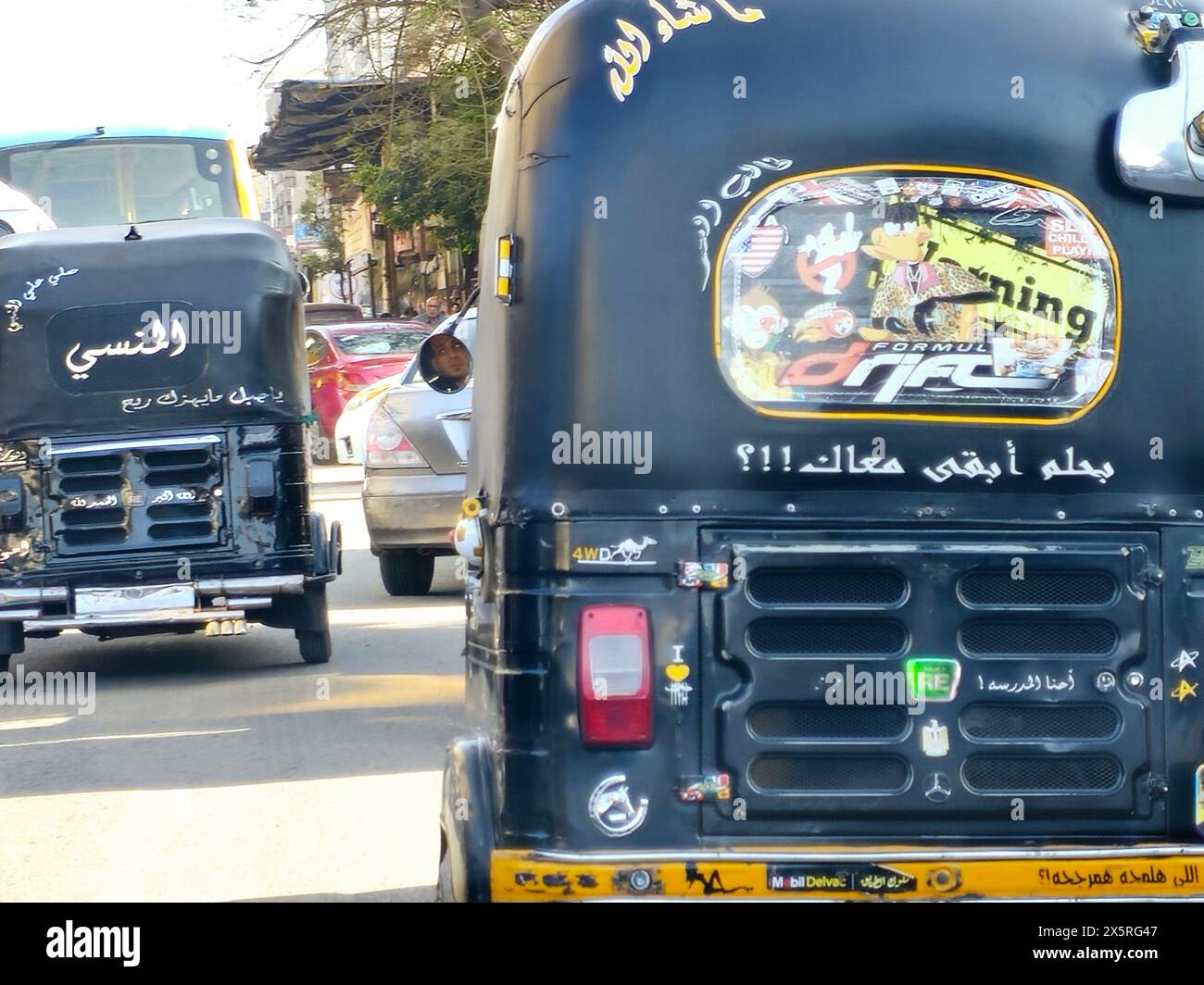 Cairo, Egypt, April 19 2024: auto rickshaw, baby taxi, mototaxi, pigeon ...