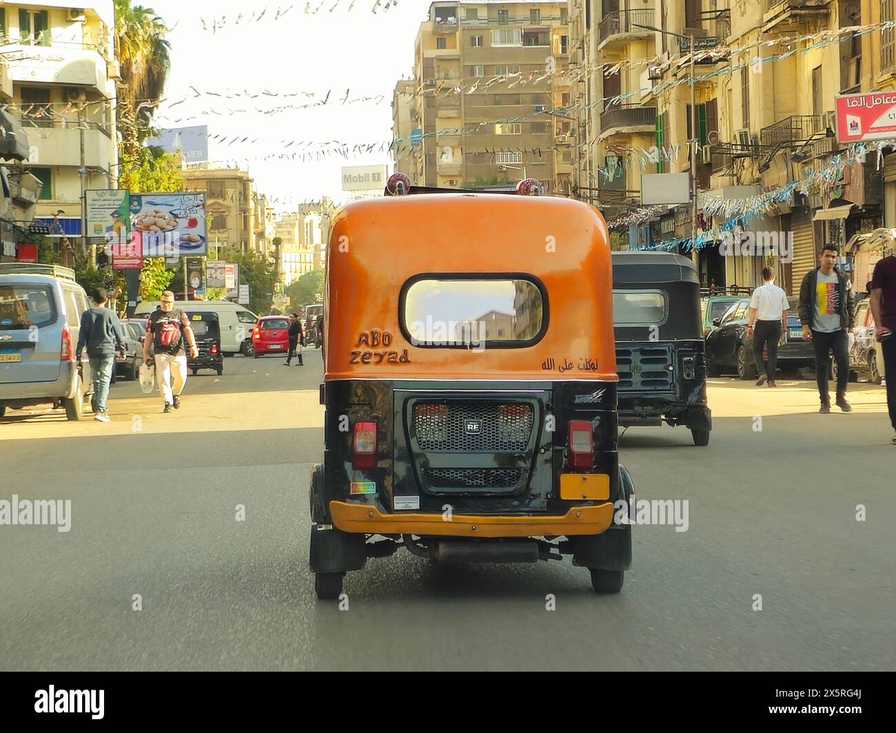 Cairo, Egypt, April 19 2024: auto rickshaw, baby taxi, mototaxi, pigeon ...