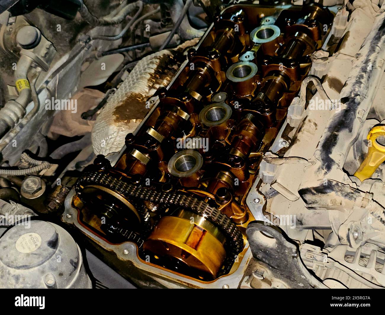 Cairo, Egypt, April 22 2024: maintenance, service, repair of car engine and cam cover rocker ...