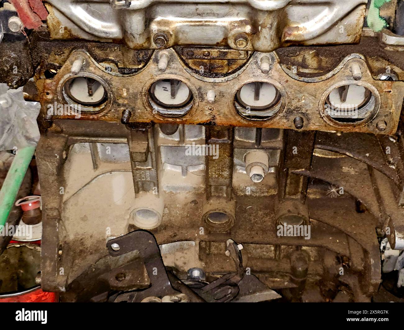A broken car engine outside the vehicle, the part was replaced, An ...