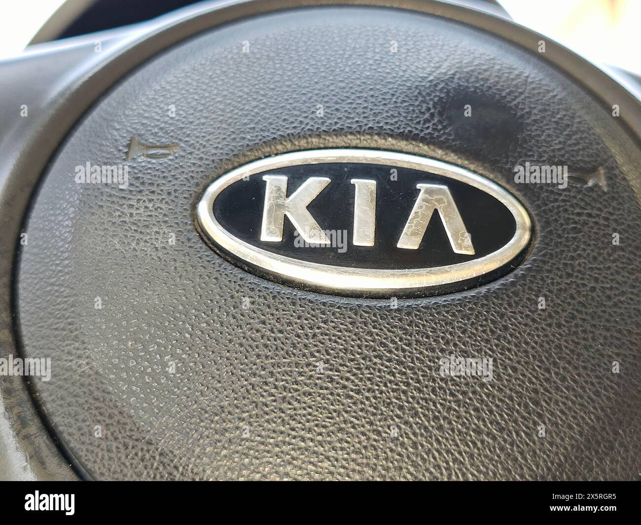 Cairo, Egypt, May 1 2024: KIA sign on a steering wheel of Cerato 2011 ...