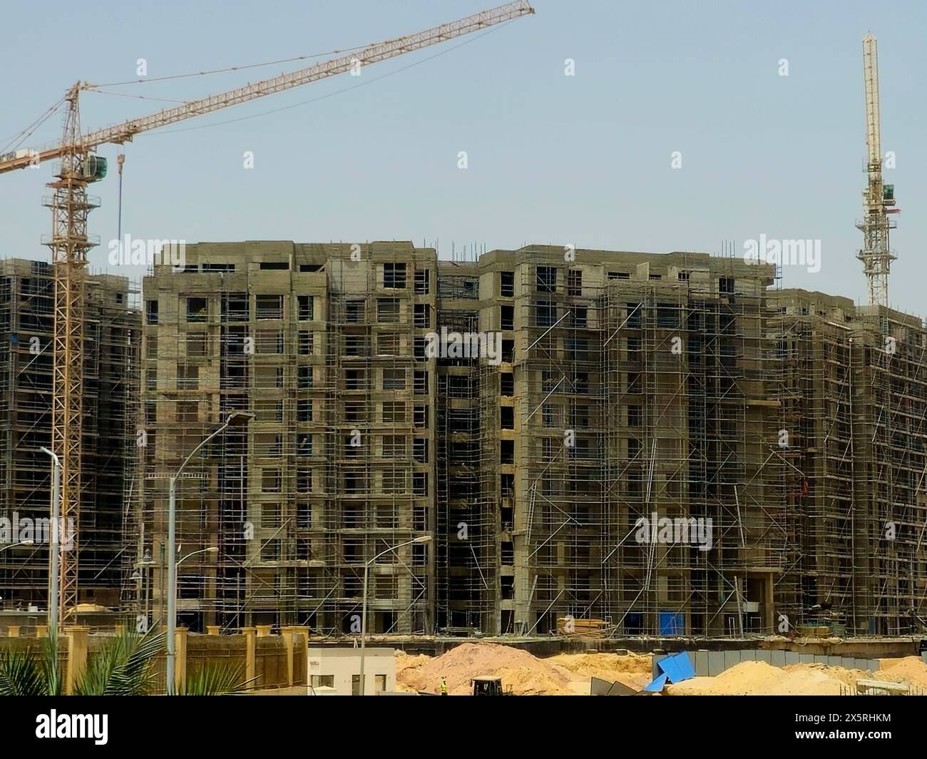 Giza, Egypt, April 25 2024: A construction site with crane towers of ...