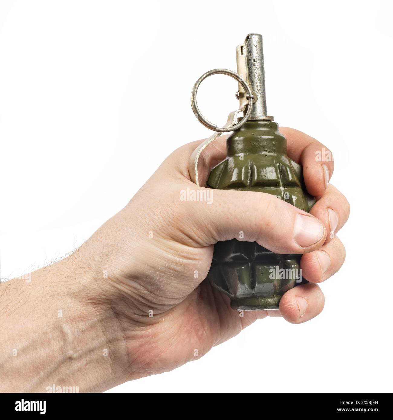 Man`s hand holds the old green shrapnel Hand Grenade Weapon of War ...