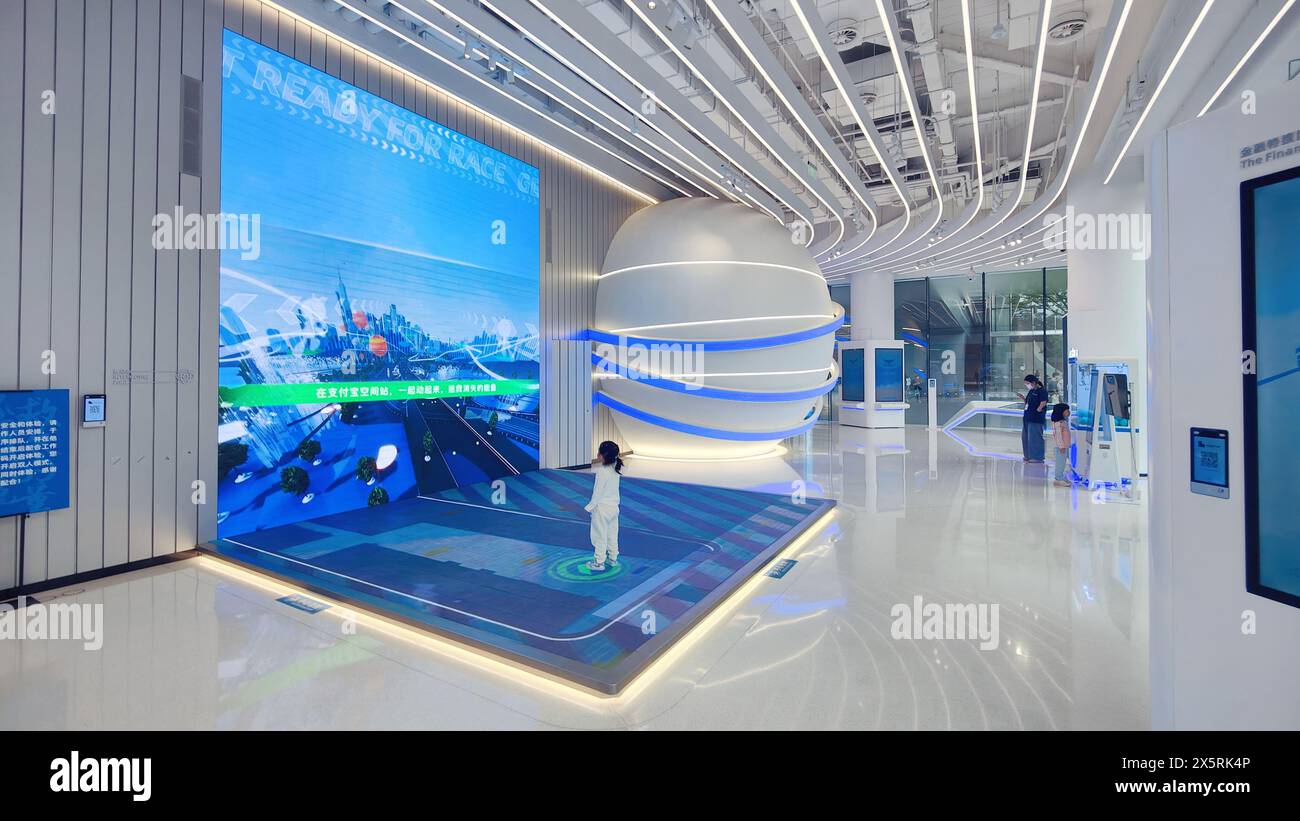 SHANGHAI, CHINA - MAY 9, 2024 - A child plays a 5G smart racing car ...