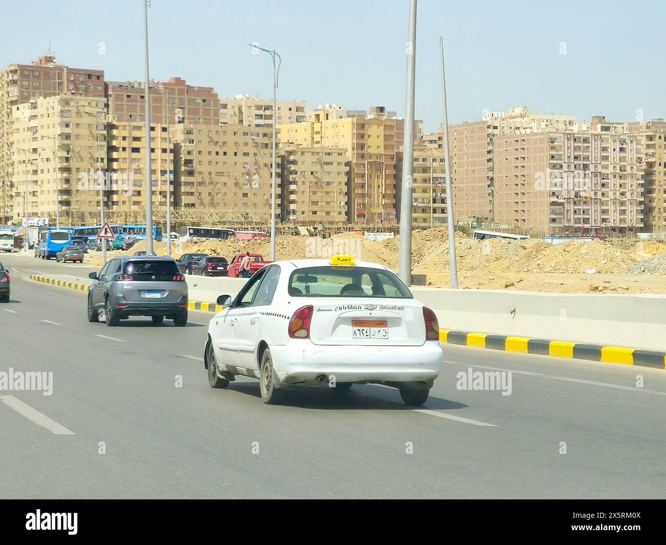 Cairo, Egypt, March 31 2024: Cairo is served by its white taxis which ...