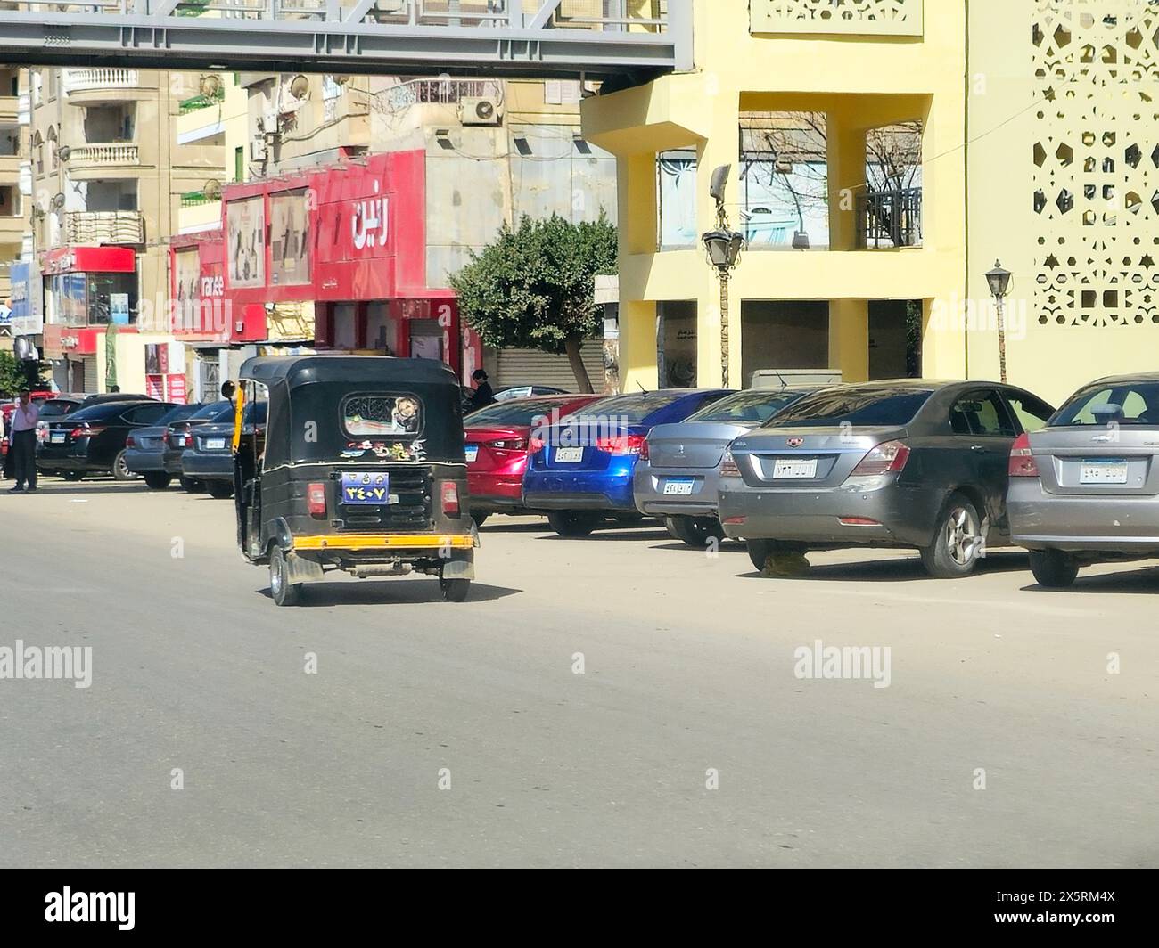 Cairo, Egypt, April 4 2024: auto rickshaw, baby taxi, mototaxi, pigeon ...