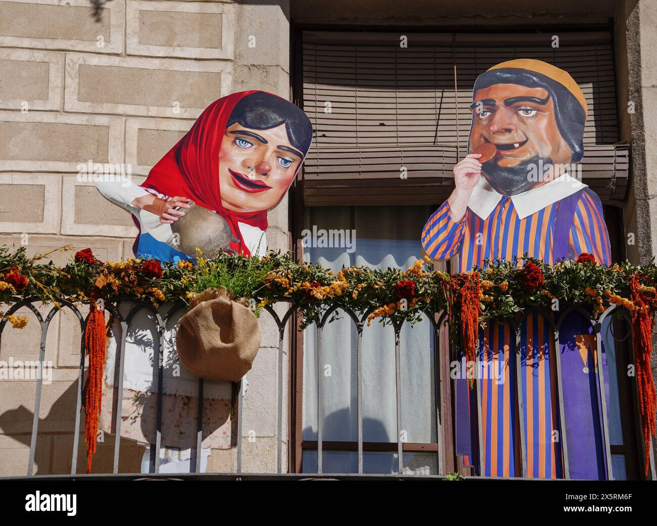 A cardboard giants couple in a balcony. Catalan popular culture in ...