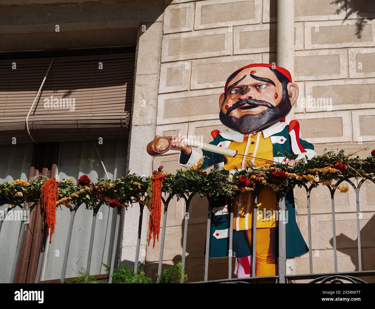 giant cardboard pirate standing on a balcony. Flower festival in Girona ...