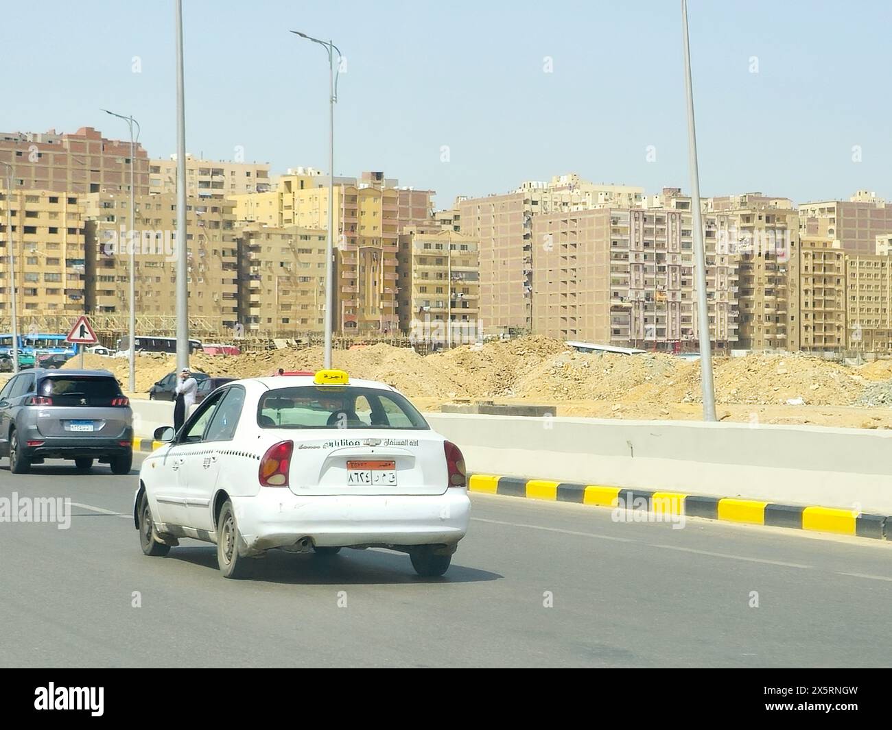 Cairo, Egypt, March 31 2024: Cairo is served by its white taxis which ...