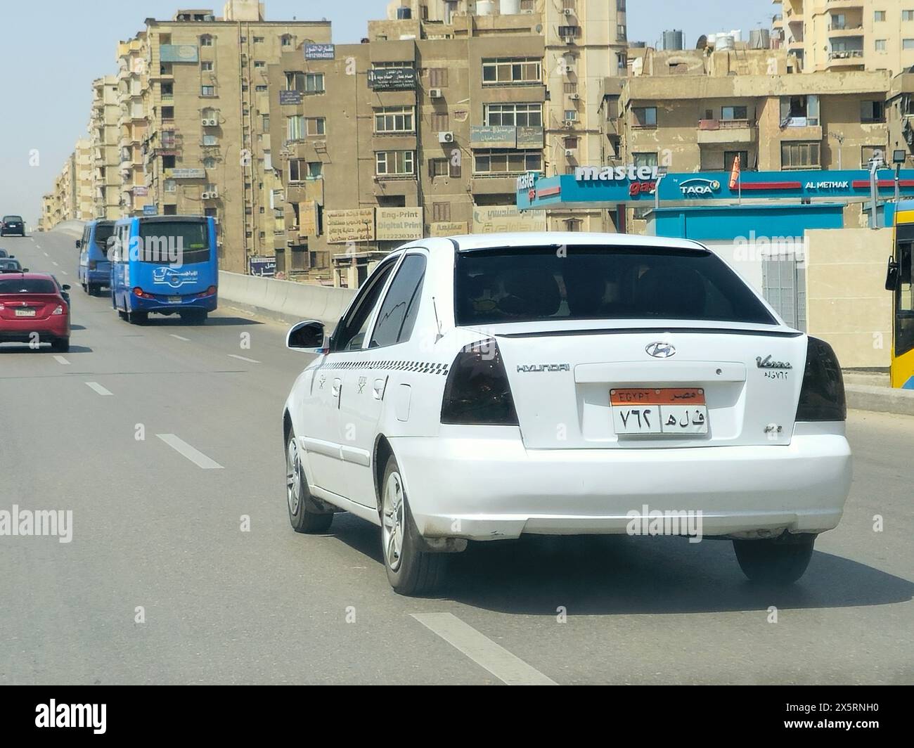 Cairo, Egypt, March 31 2024: Cairo is served by its white taxis which ...