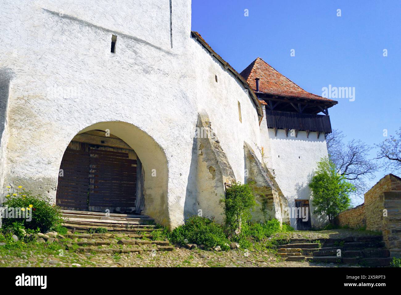 Gate of the fortified Viscri church and watchtower (Transylvania ...