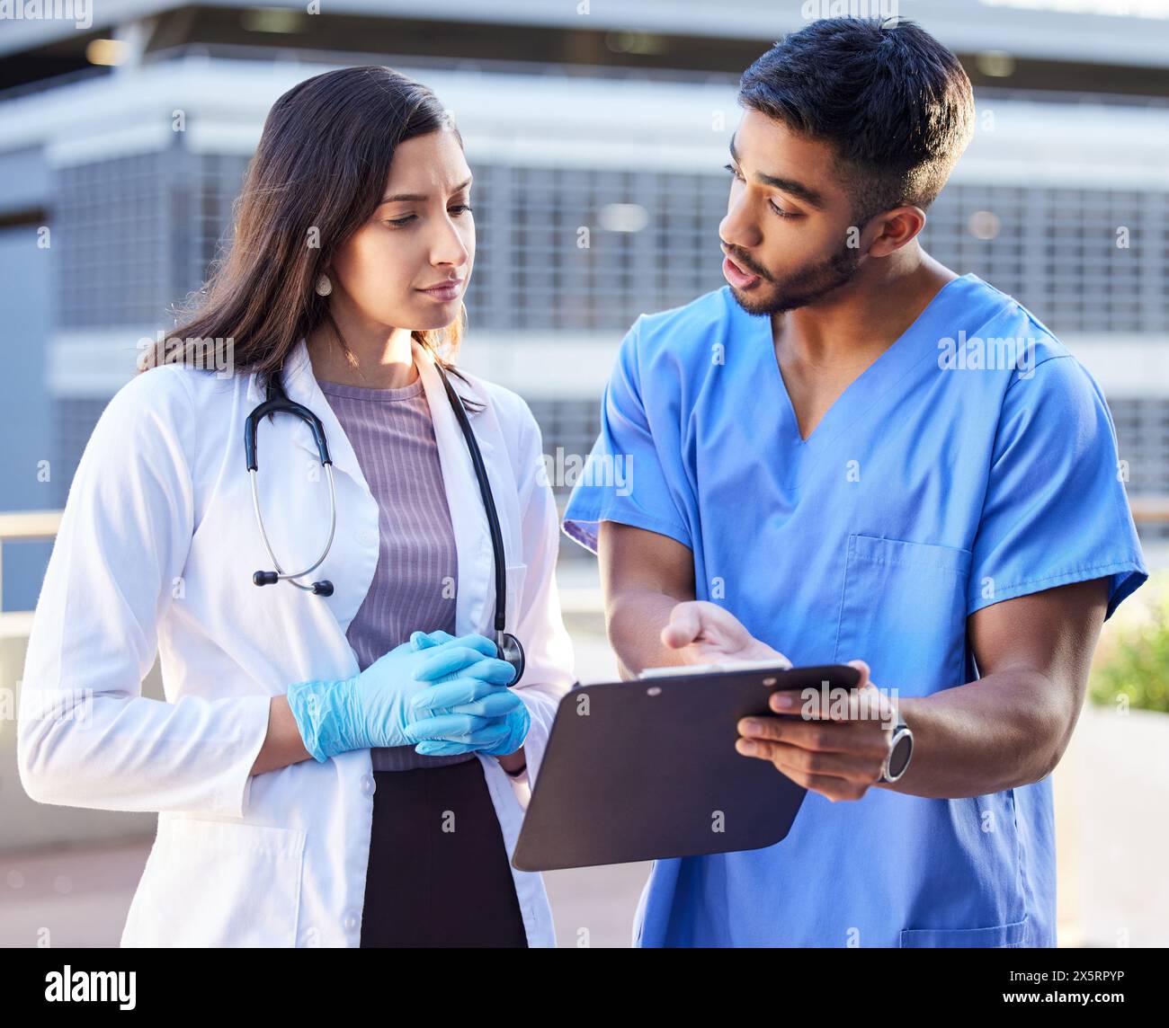 Team, doctor and nurse with clipboard outdoor for medical chart ...