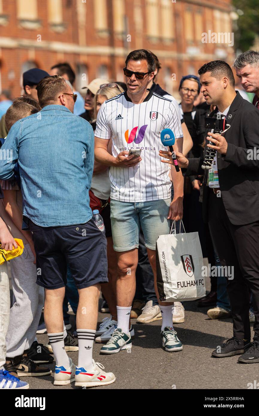 Fulham fans await the arrival of the team bus ahead of the Premier ...