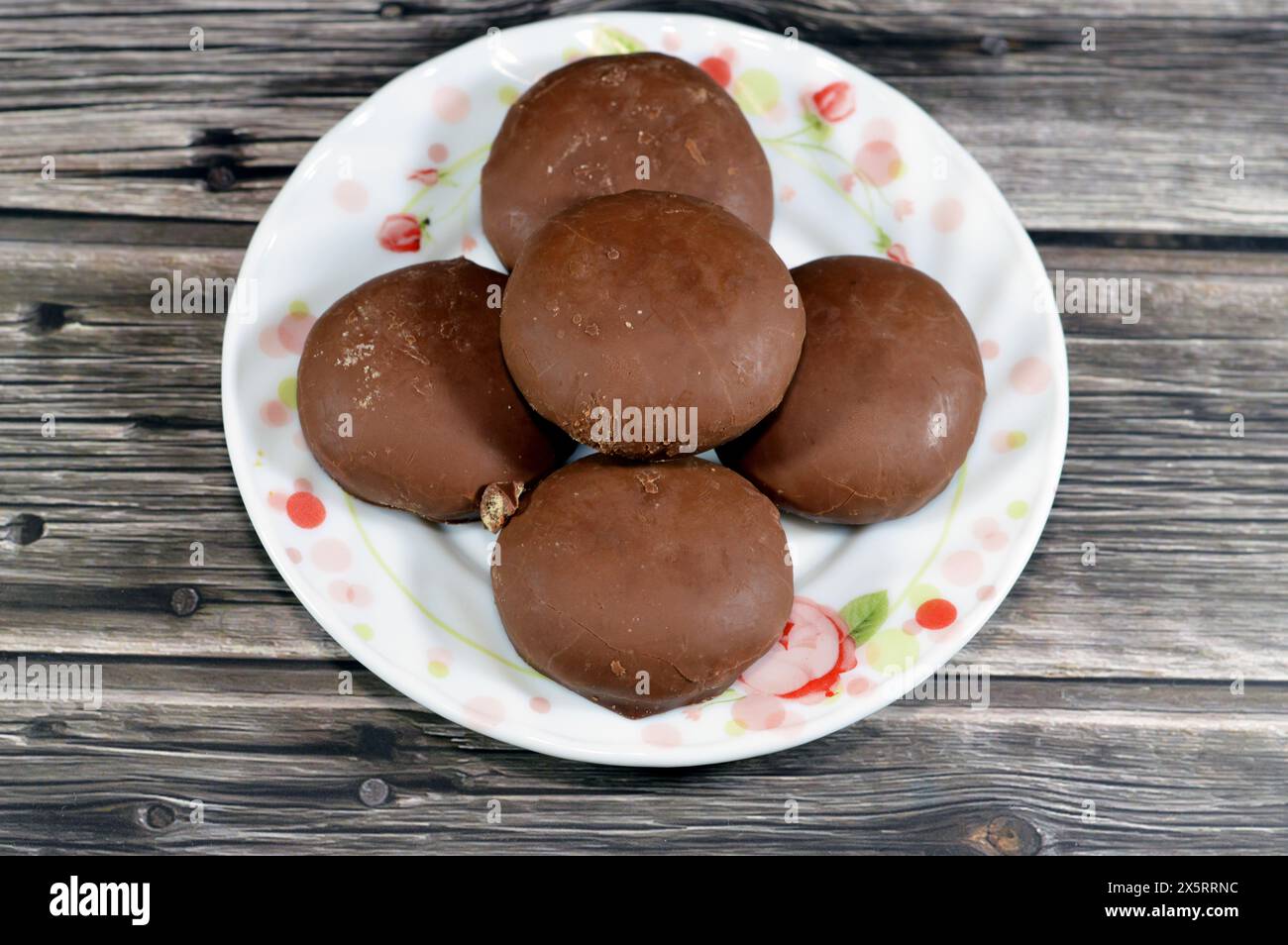 Maamoul coated with brown dark chocolate and filled with dates cookies ...