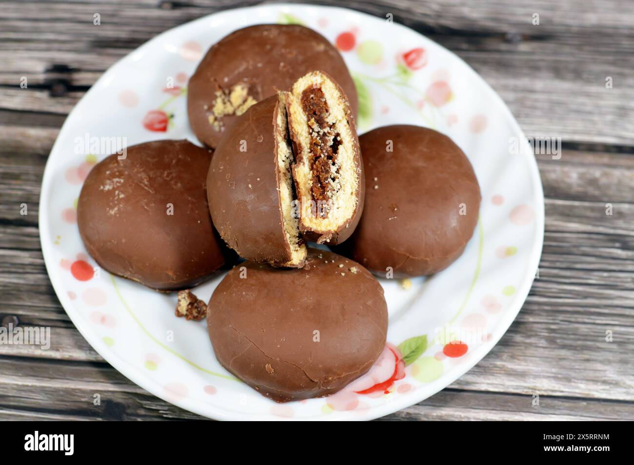 Maamoul coated with brown dark chocolate and filled with dates cookies ...