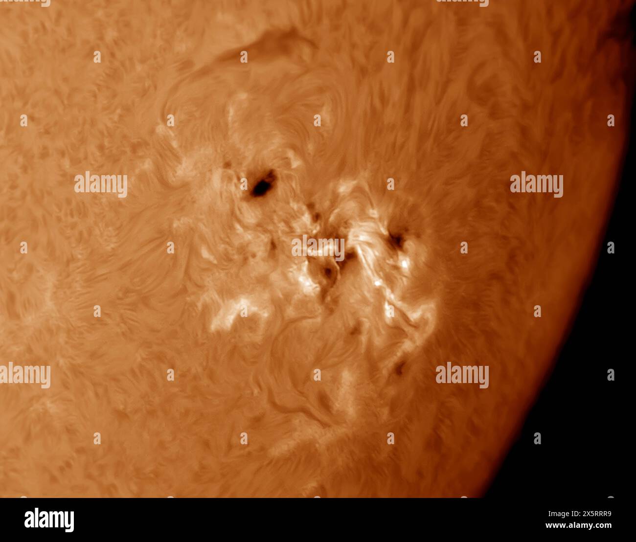 London, UK. 11th May, 2024. Solar telescope image of massive and ...