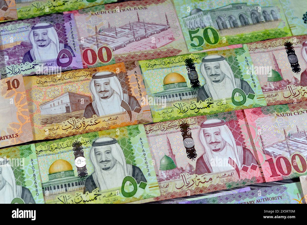 Background of Saudi Arabia money banknotes bill of different values ...