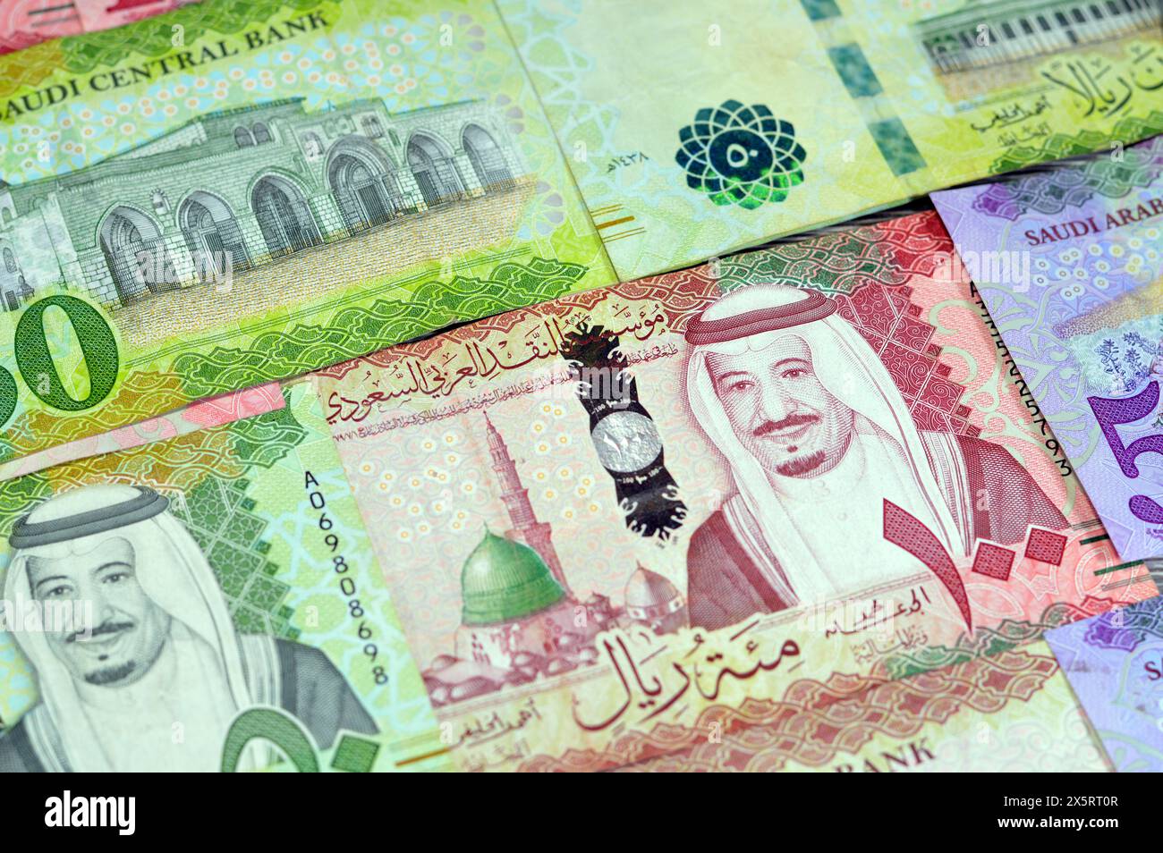 Background of Saudi Arabia money banknotes bill of different values ...
