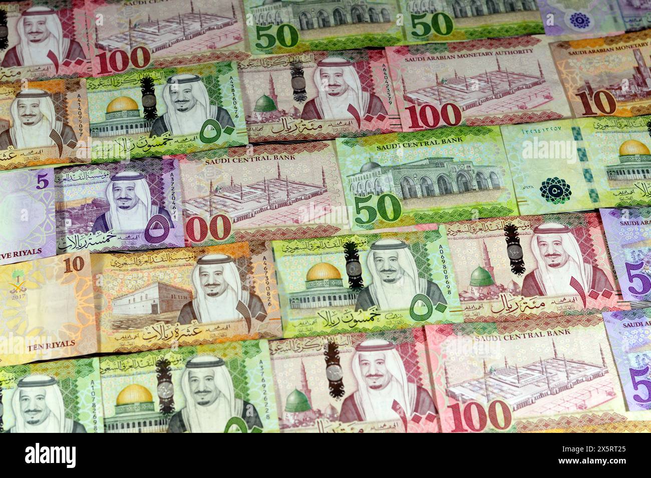 Background of Saudi Arabia money banknotes bill of different values ...