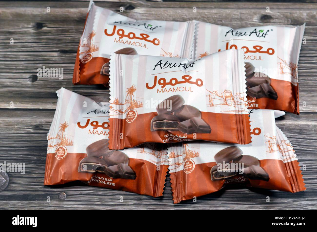Cairo, Egypt, April 8 2024: Abu Auf Maamoul coated with brown dark ...